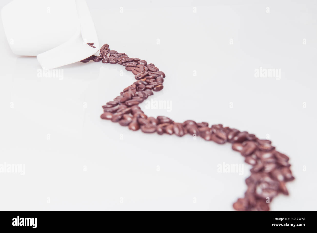 Coffee beans path that goes into the coffee cup Stock Photo - Alamy
