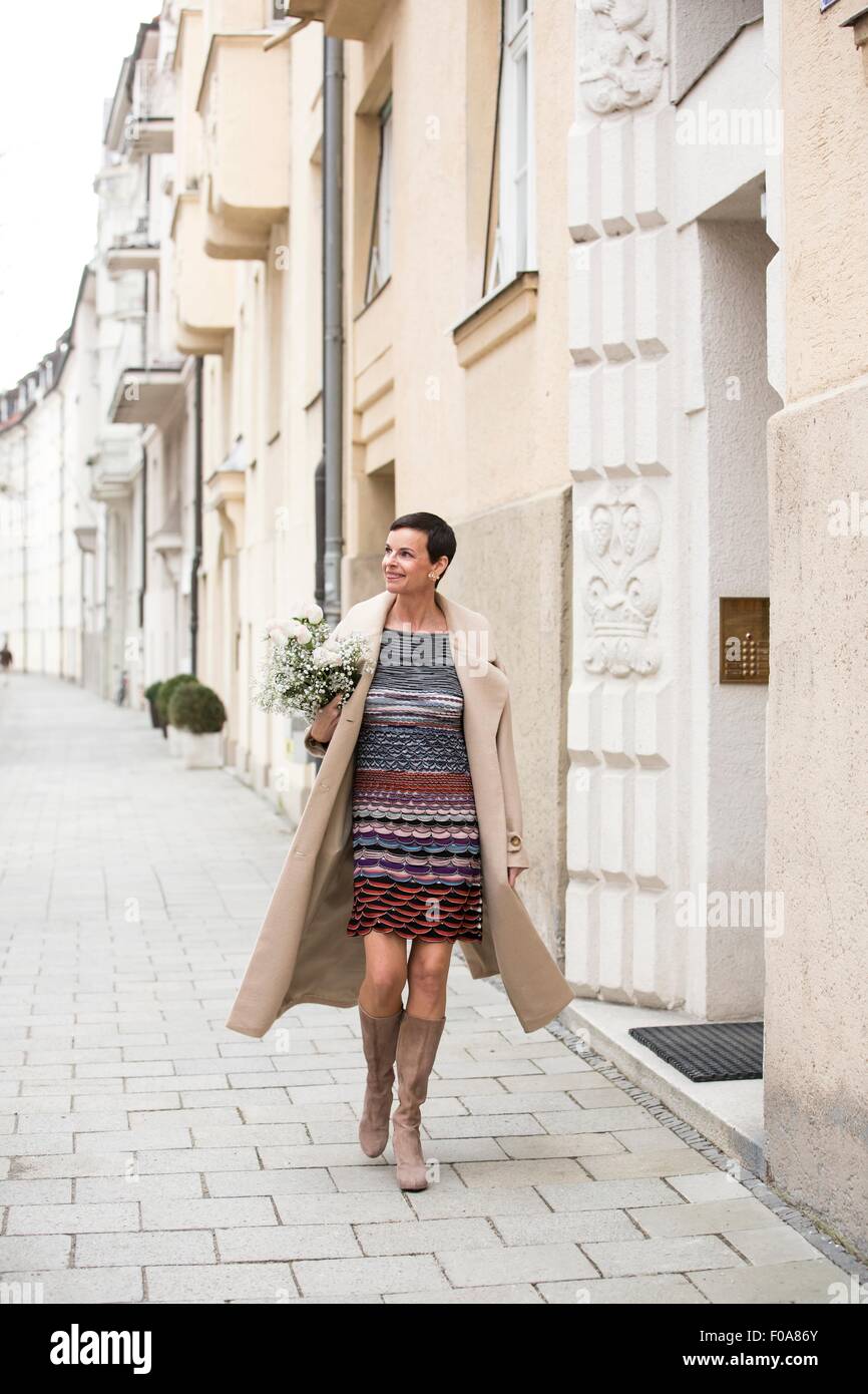 Woman flowers walking on hi-res stock photography and images - Alamy