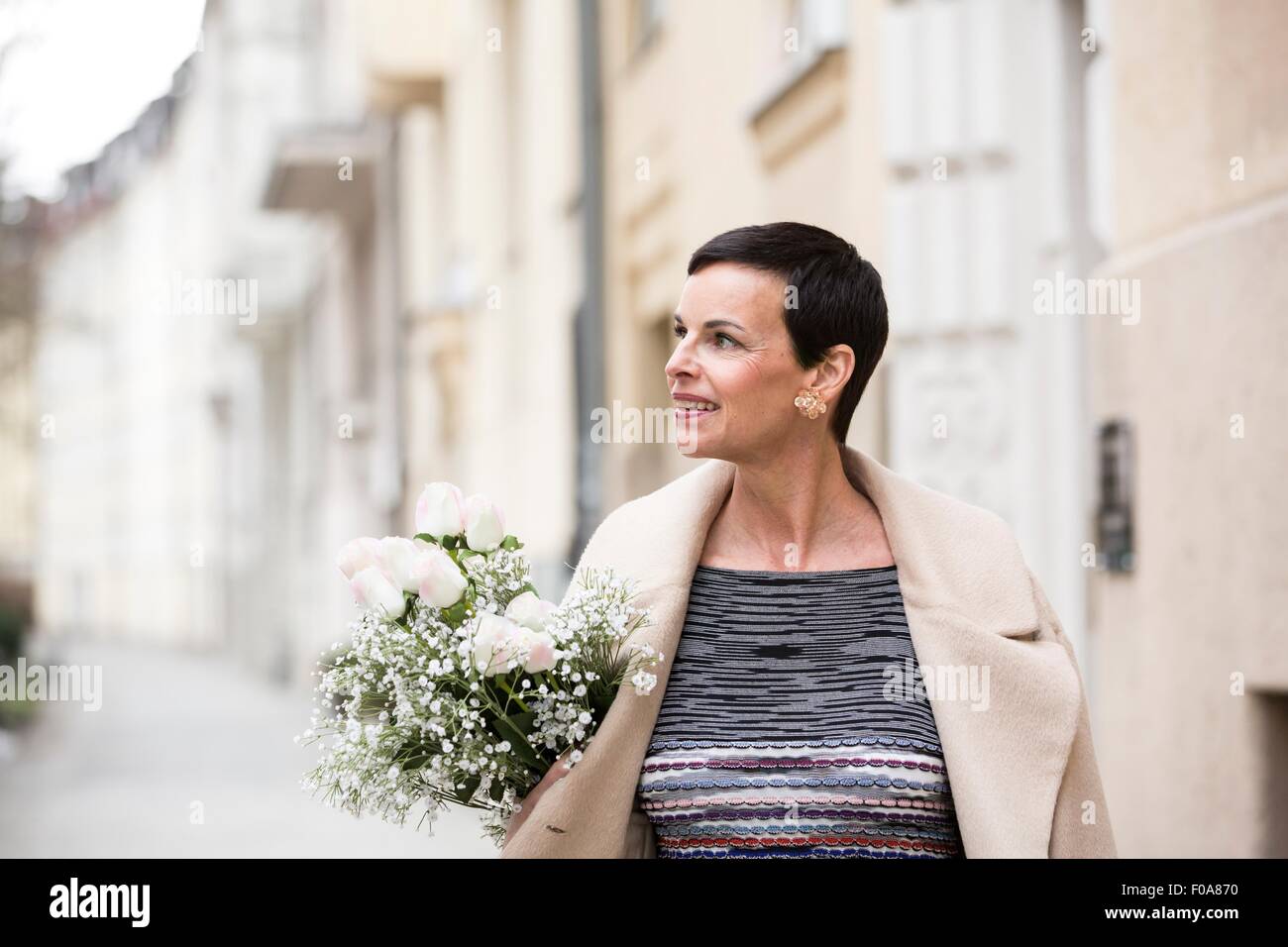 Woman flowers walking on hi-res stock photography and images - Alamy