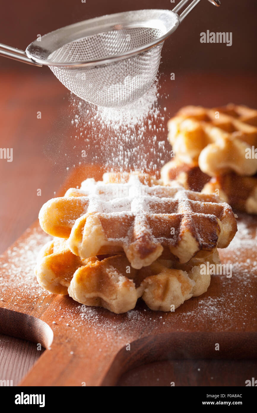 belgian waffles sprinkled with icing sugar Stock Photo - Alamy