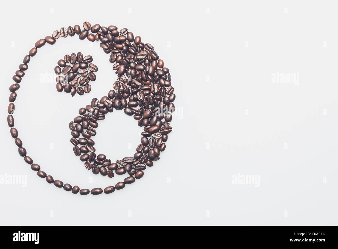 Yin yang symbol made with coffee beans. White background Stock Photo ...