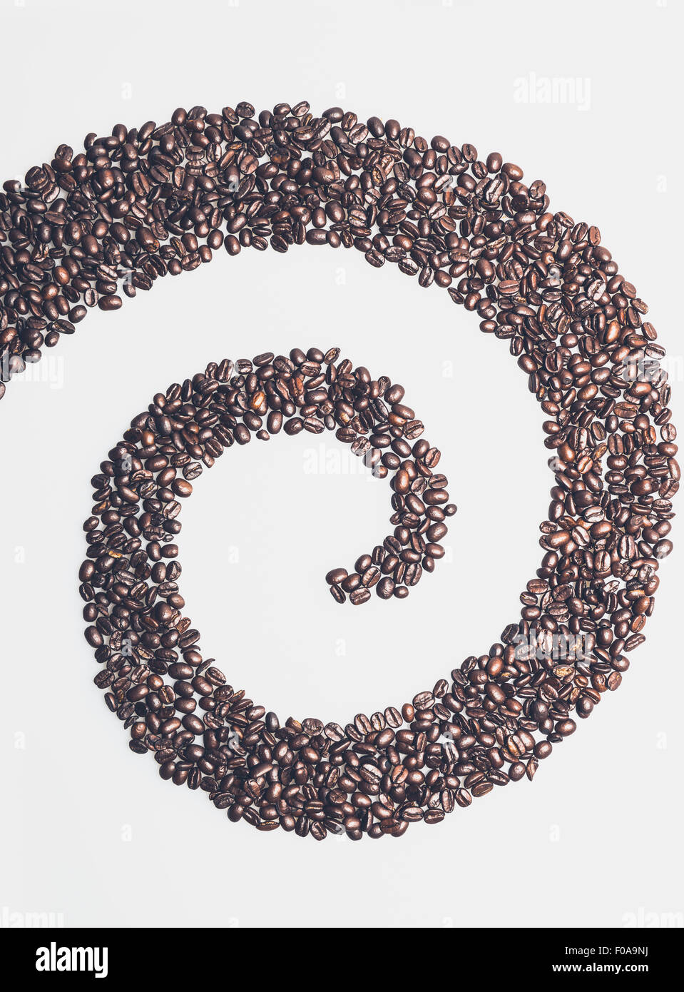 Coffee whirl symbol made with coffee beans Stock Photo - Alamy