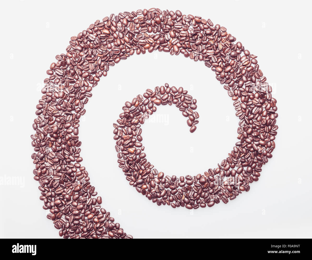 Coffee whirl symbol made with coffee beans Stock Photo - Alamy