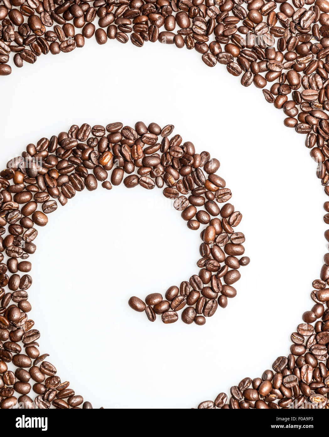 Coffee whirl symbol made with coffee beans Stock Photo - Alamy