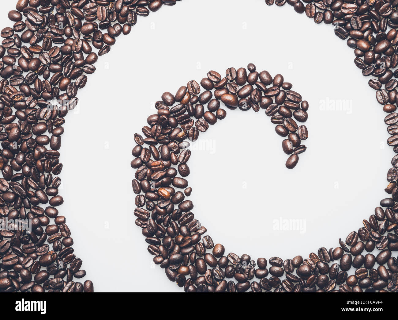 Coffee whirl symbol made with coffee beans Stock Photo - Alamy