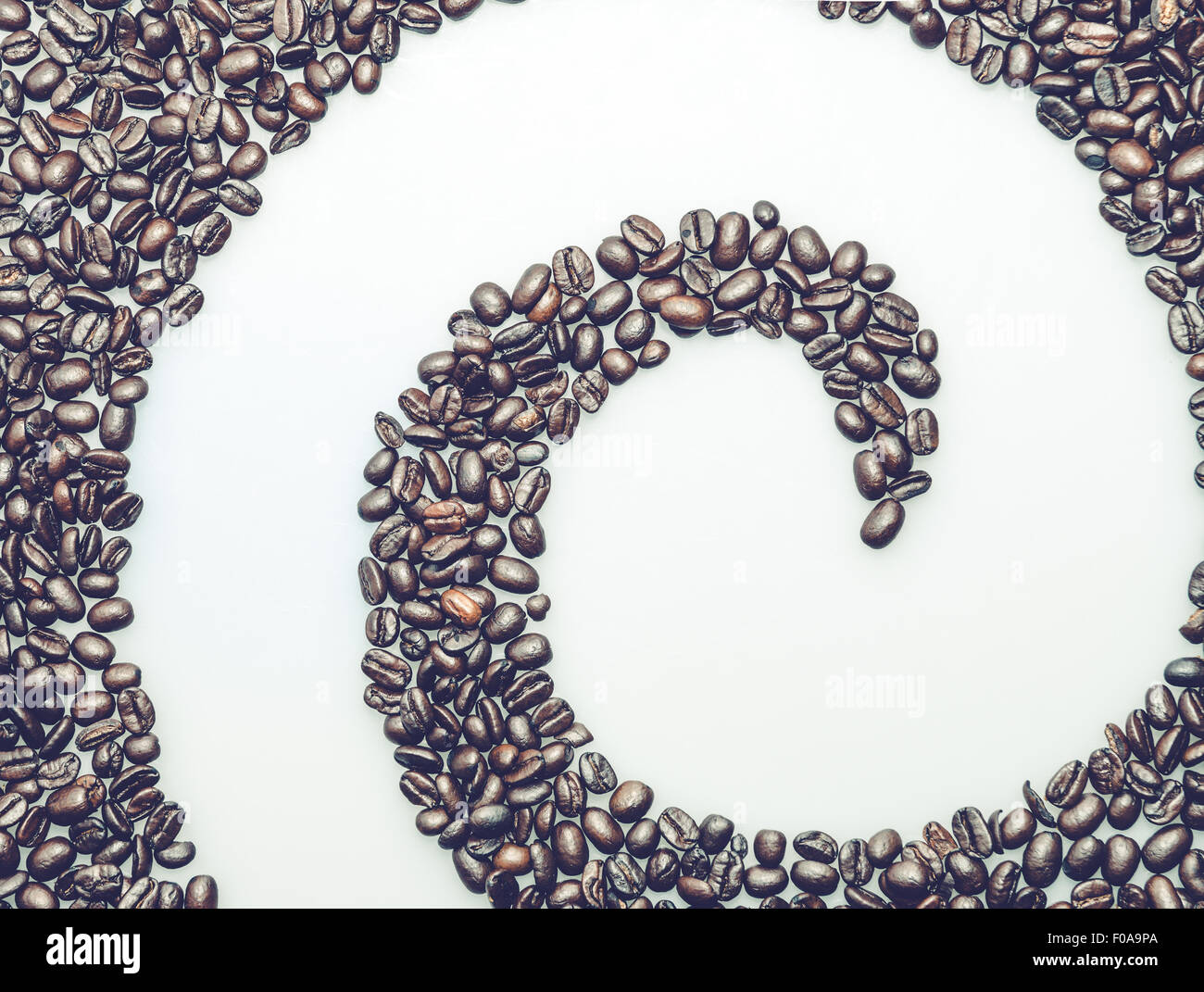 Coffee whirl symbol made with coffee beans Stock Photo - Alamy