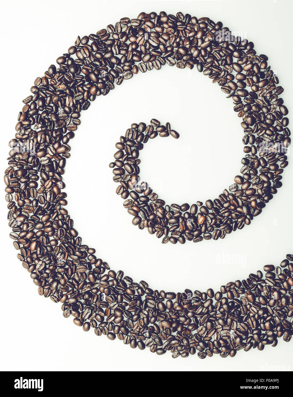 Coffee whirl symbol made with coffee beans Stock Photo - Alamy