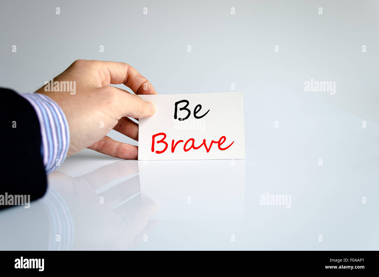 Be brave text concept isolated over white background Stock Photo - Alamy