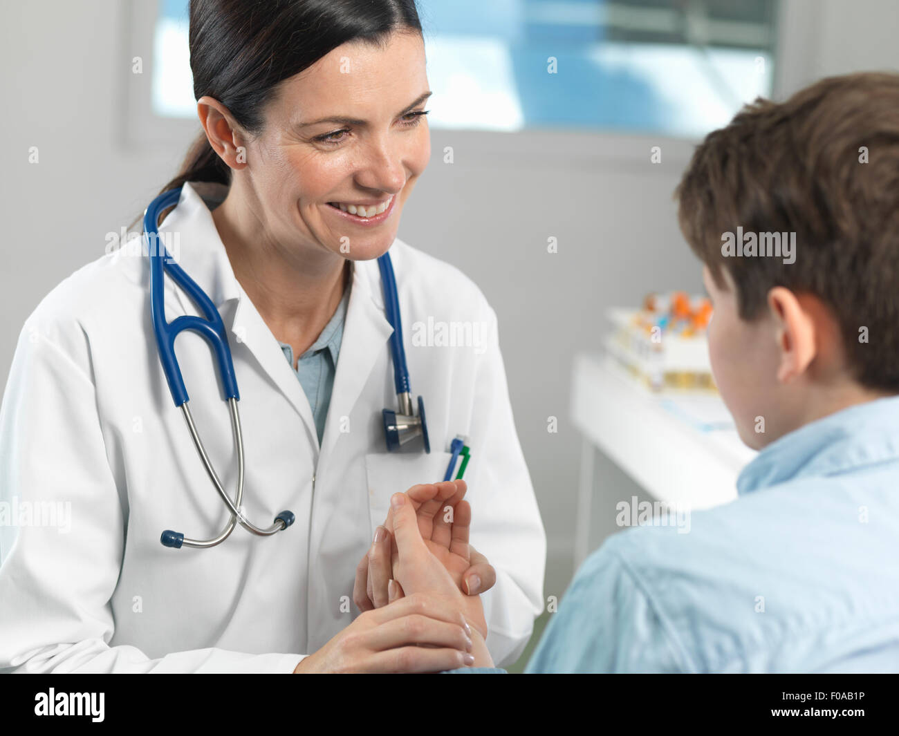 Doctor checking hi-res stock photography and images - Alamy