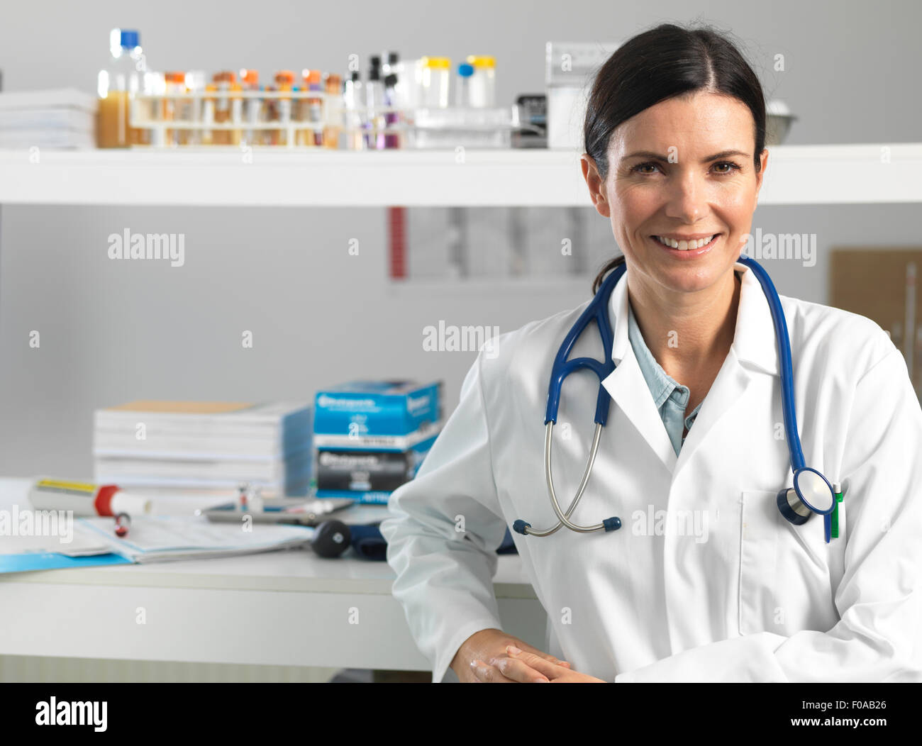 Doctor at desk awaiting patient Stock Photo - Alamy