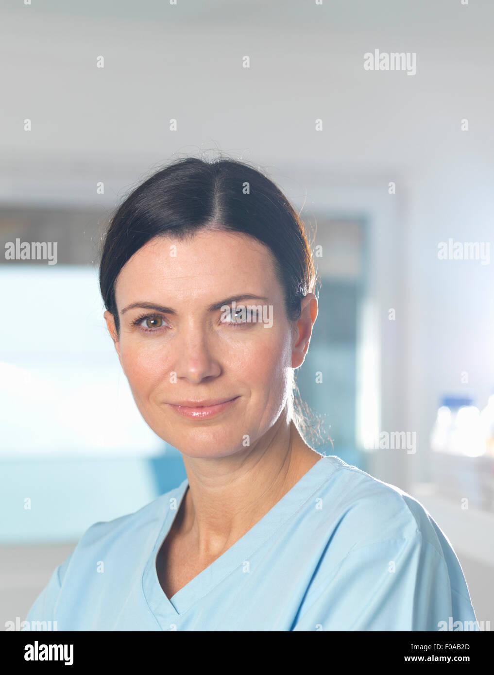 Health worker at work, window in background Stock Photo - Alamy