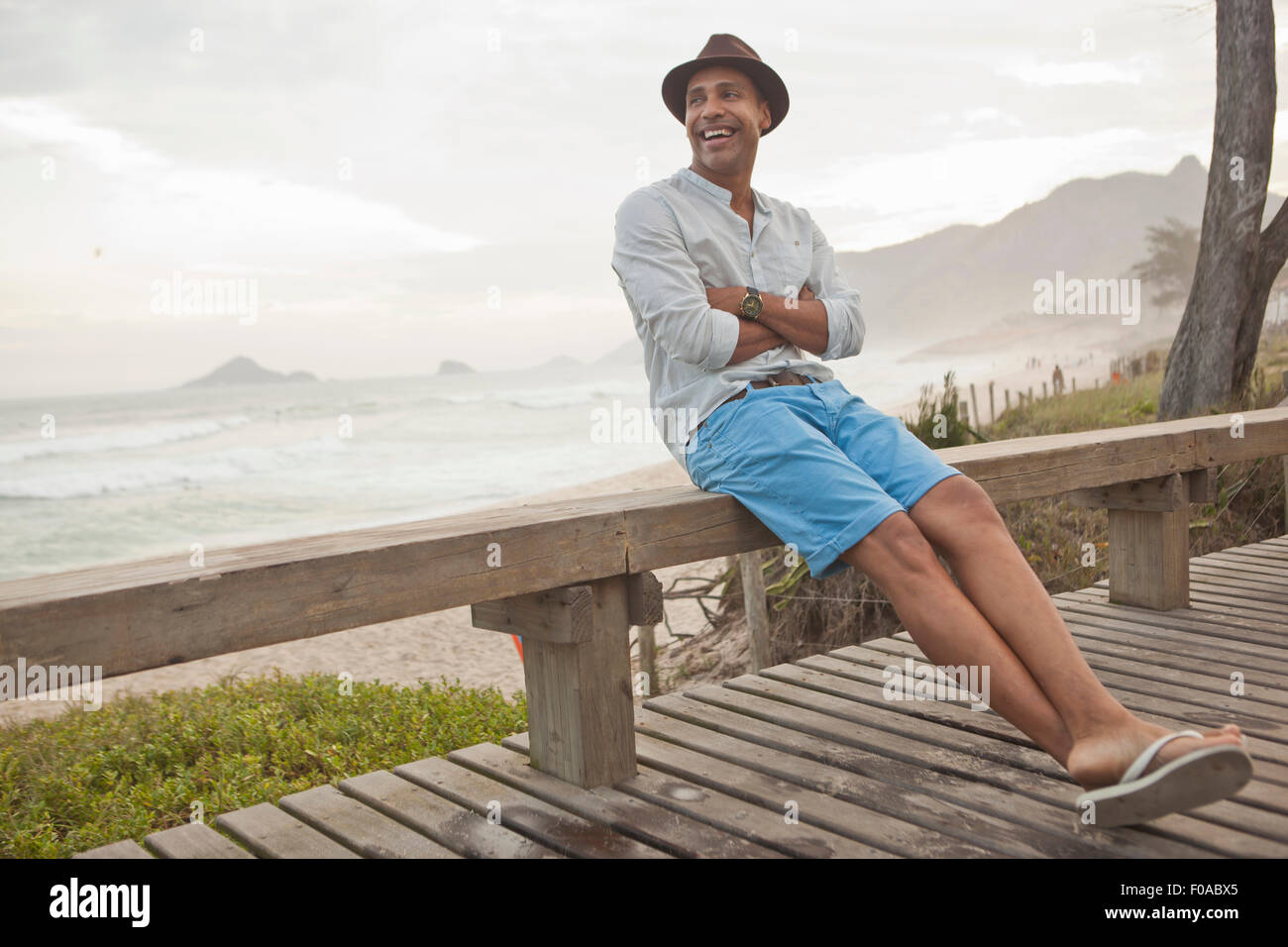 Man sitting fence hi-res stock photography and images - Alamy