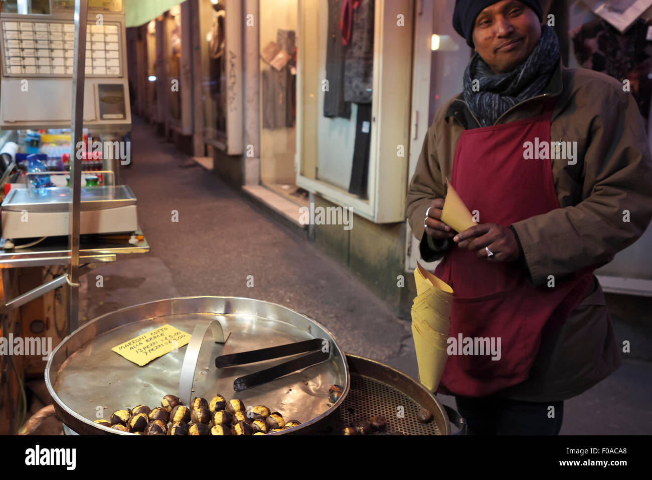 Chestnut seller roasts and sells chestnuts on the street of Via ...