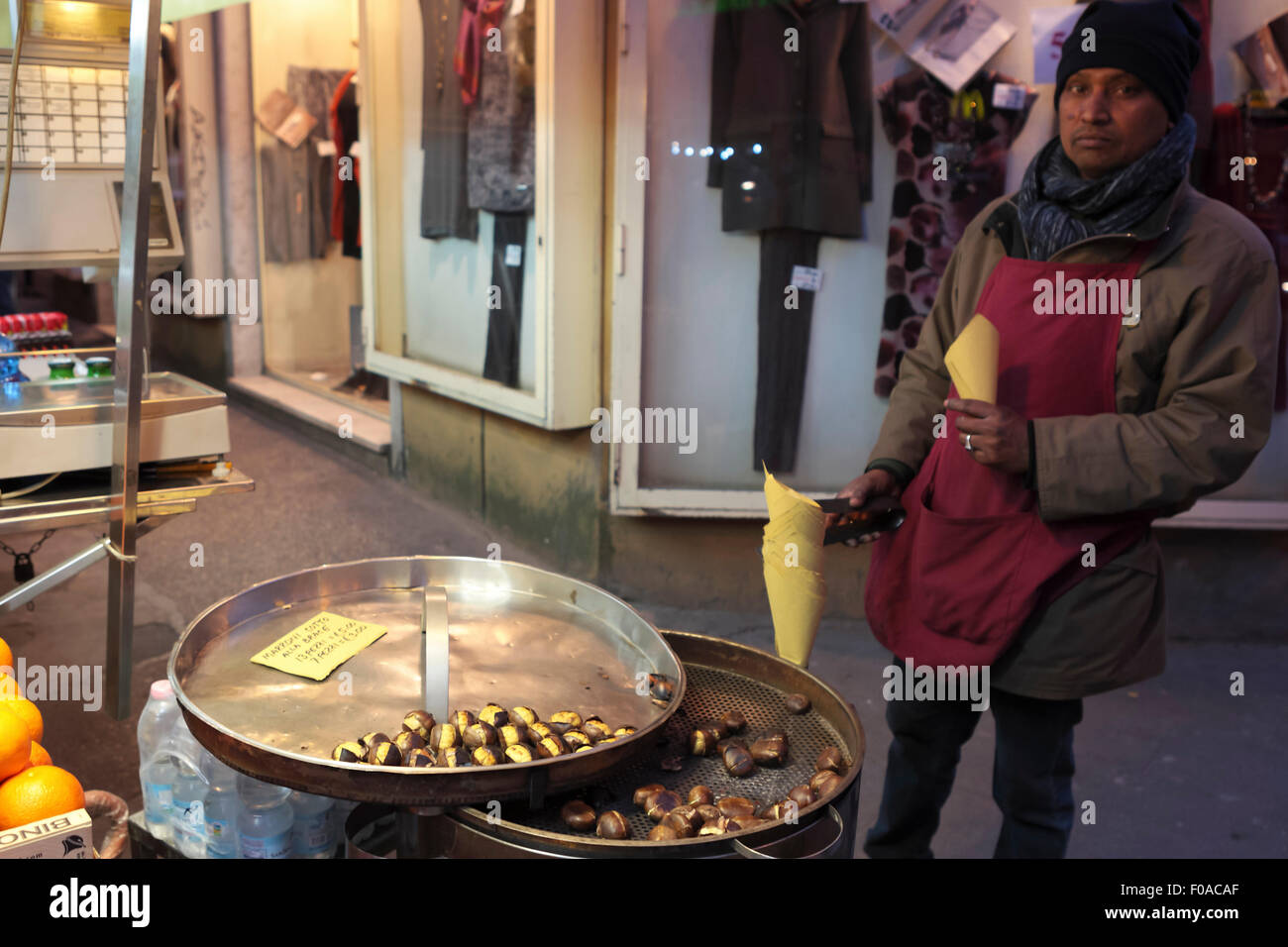 Chestnut seller roasts and sells chestnuts on the street of Via ...