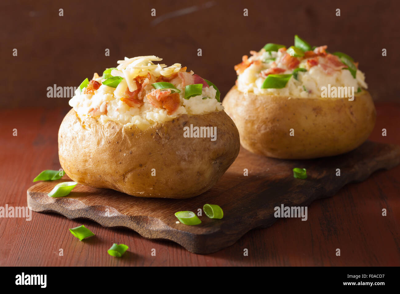 baked potato in jacket with bacon and cheese Stock Photo - Alamy