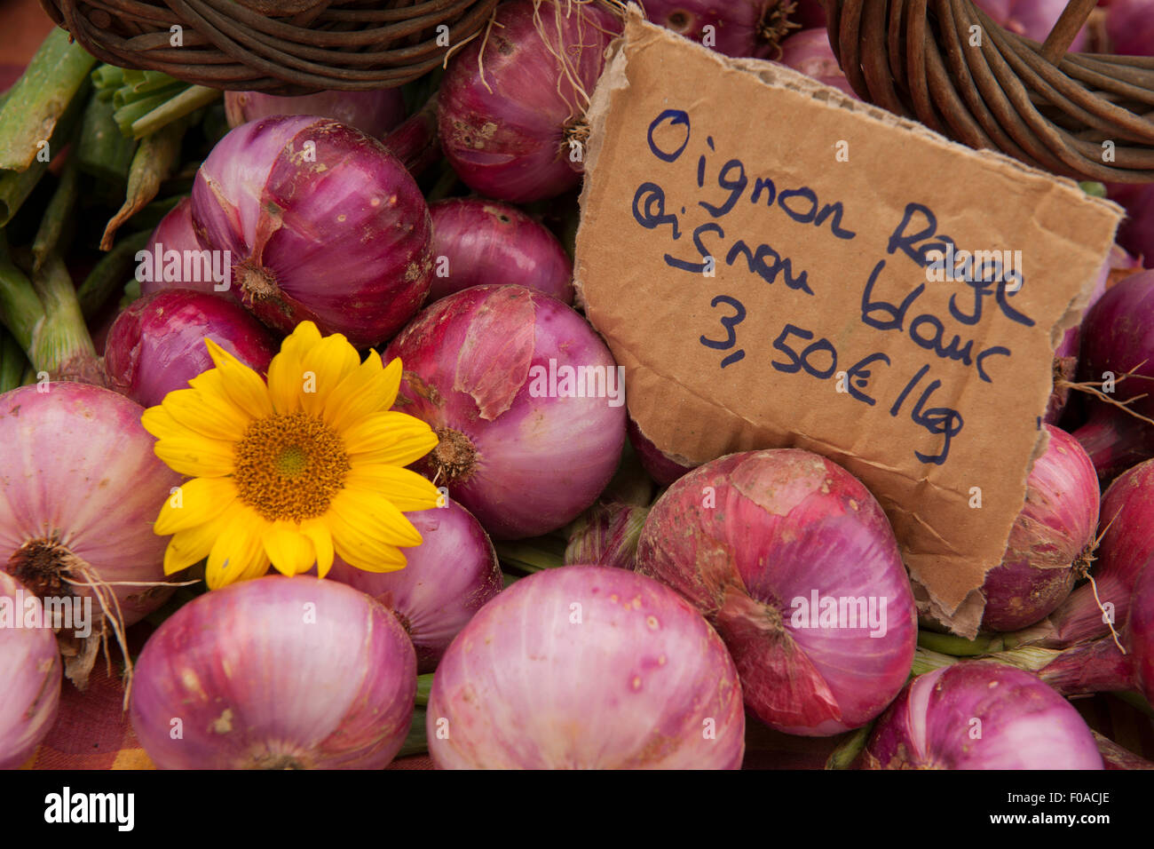 Traditional French market stall with onions on display, Issigeac ...