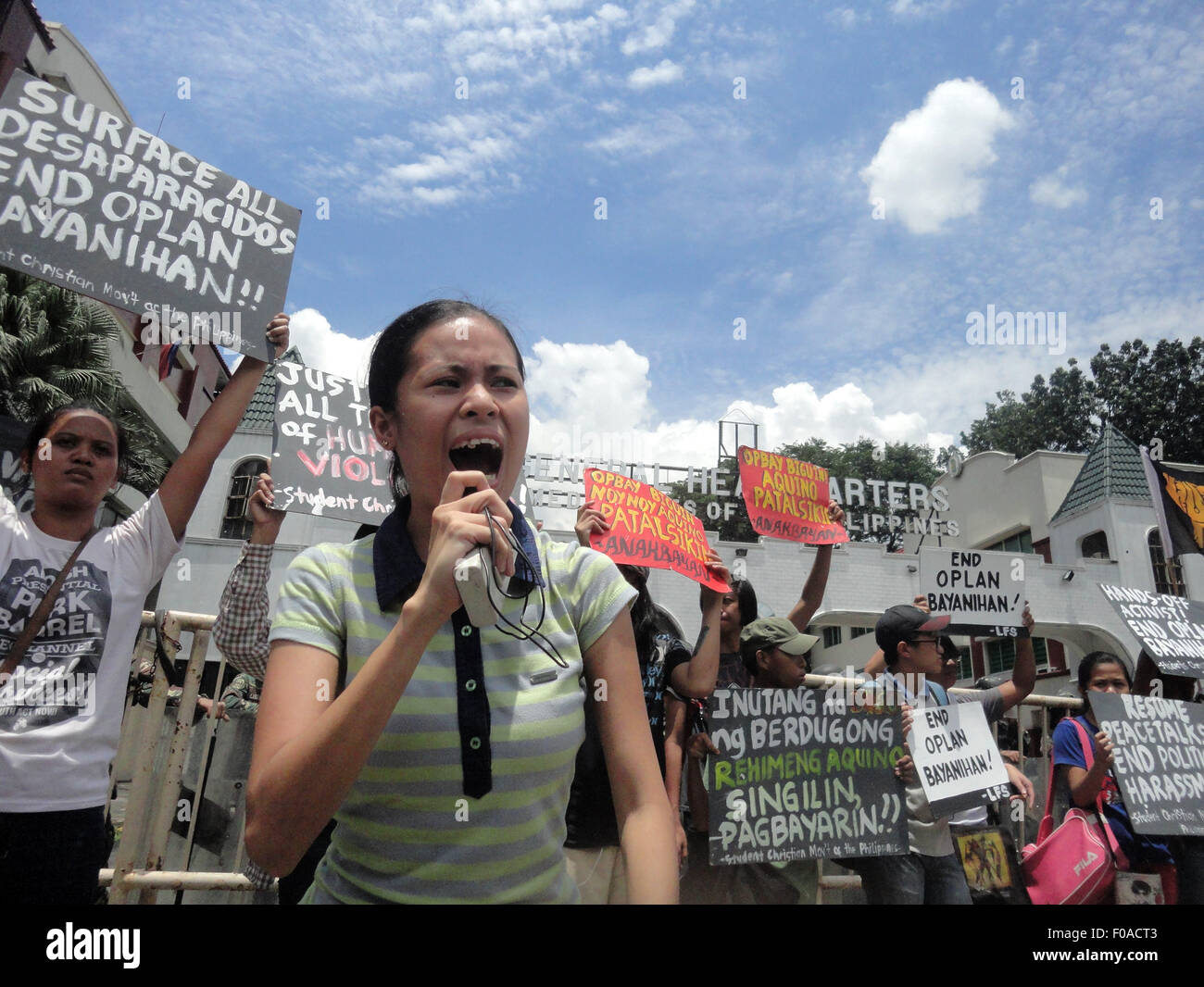 Quezon City, Philippines. 11th Aug, 2015. A Filipino activist speaks ...