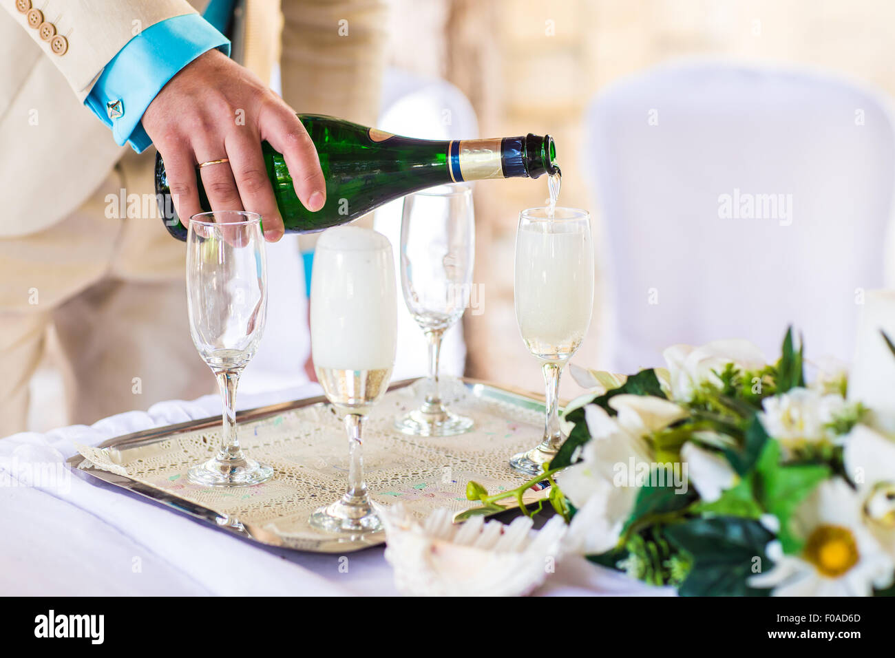 Banquet event. Man pouring champagne Stock Photo - Alamy