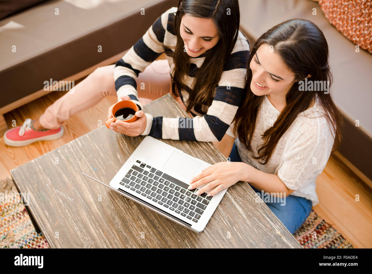 Female friends studying at the local coffee shop Stock Photo - Alamy