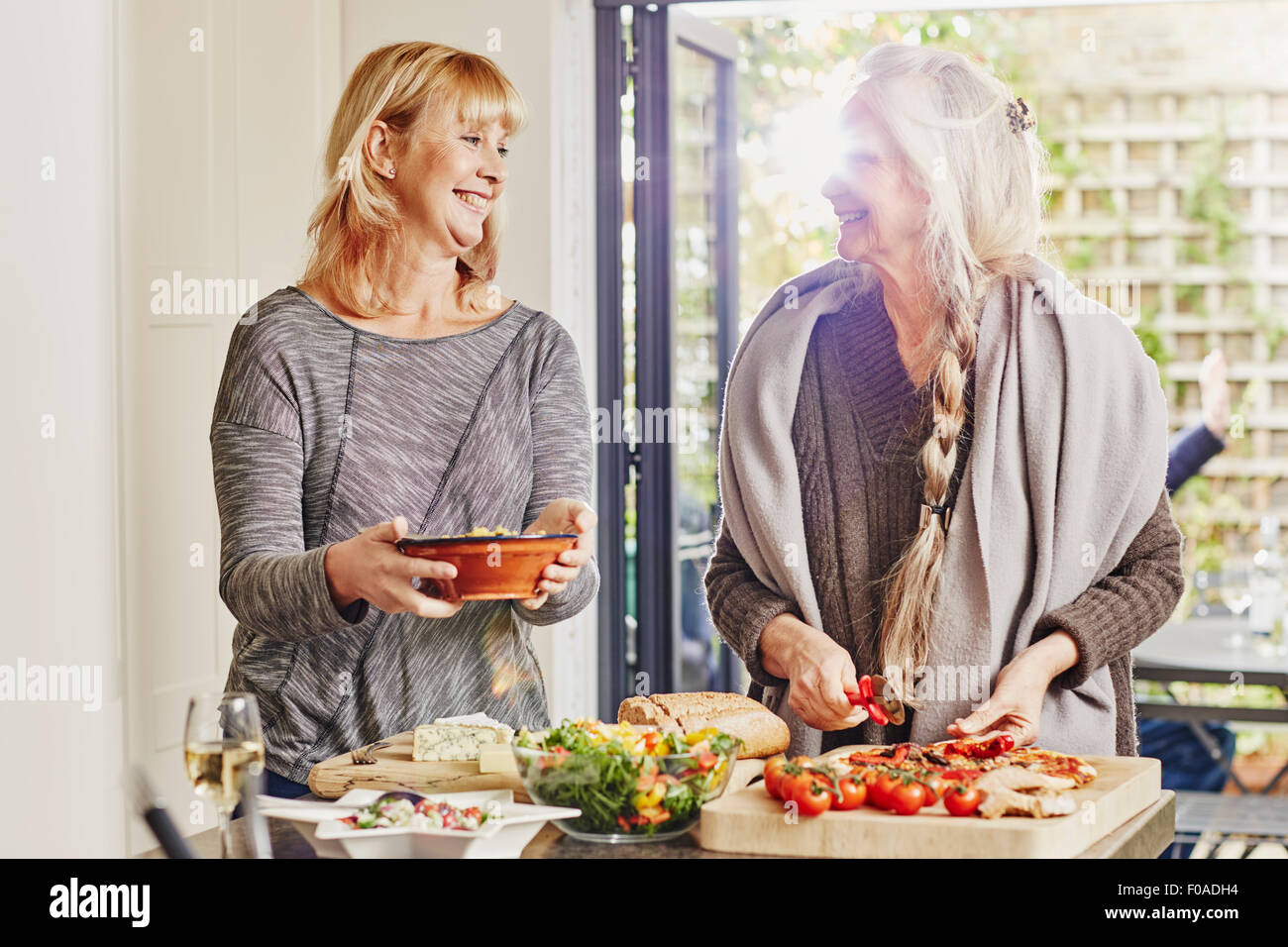 Two people preparing meal hi-res stock photography and images - Alamy