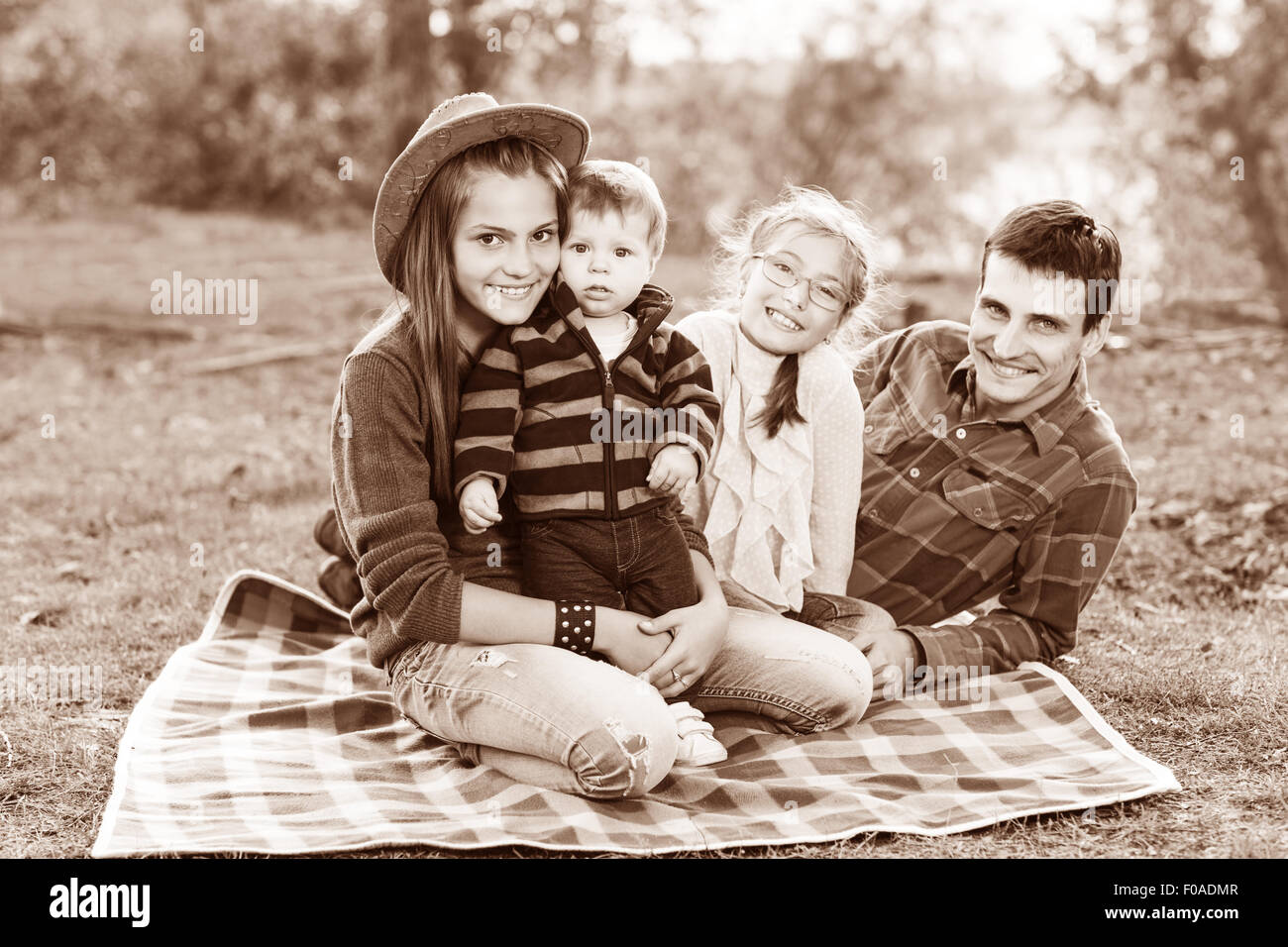 Happy family outdoors Stock Photo - Alamy