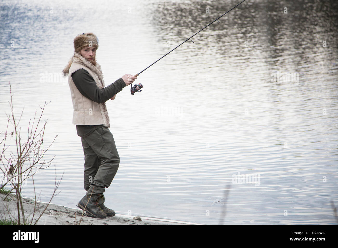Man using fishing rod hi-res stock photography and images - Alamy