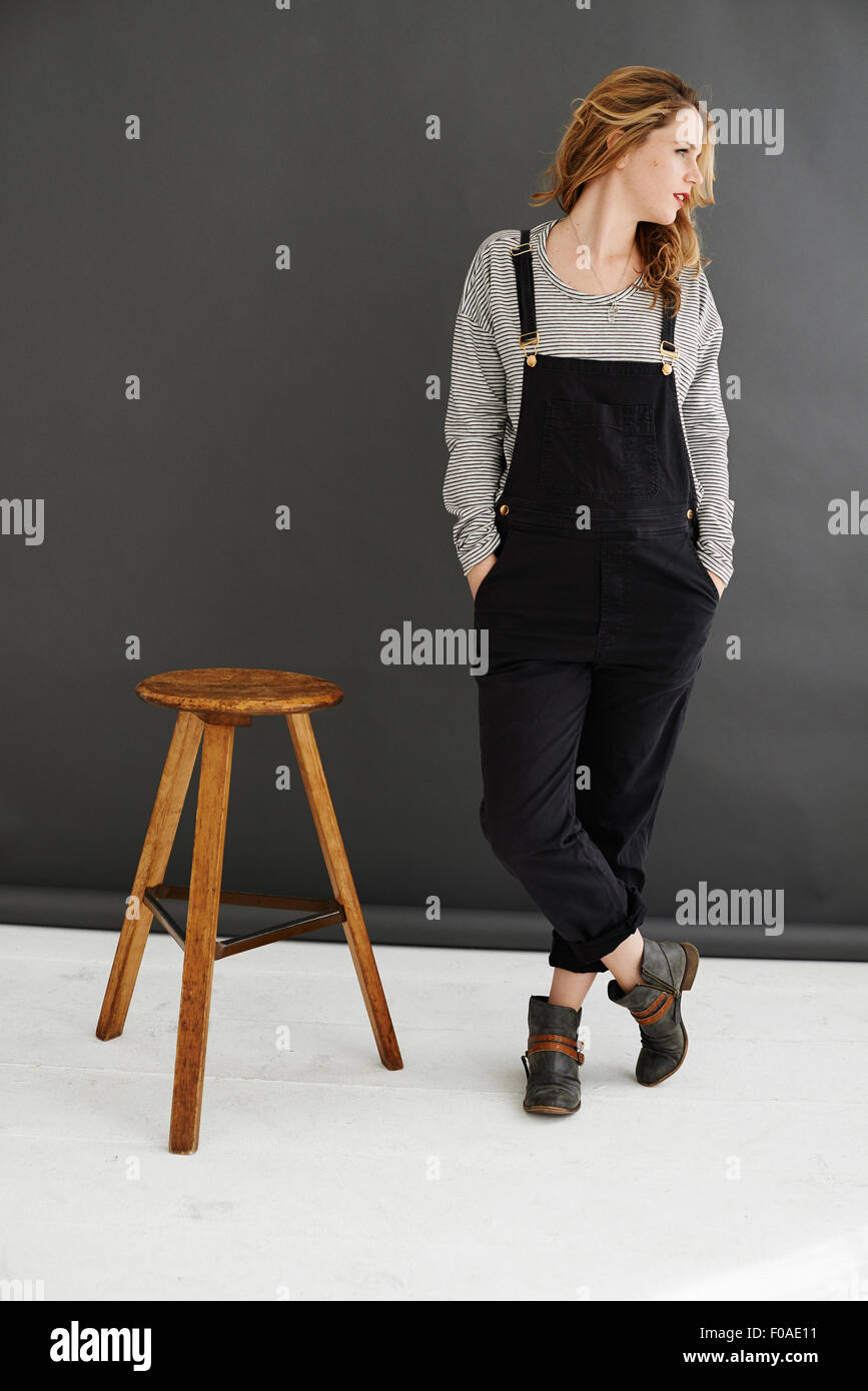Woman crossed legs stool hi-res stock photography and images - Alamy