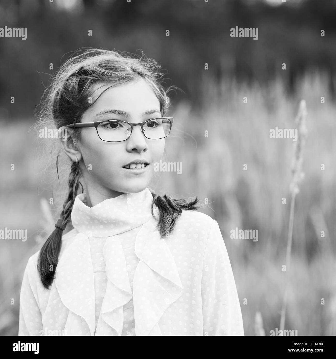 Adorable girl in glasses Stock Photo - Alamy
