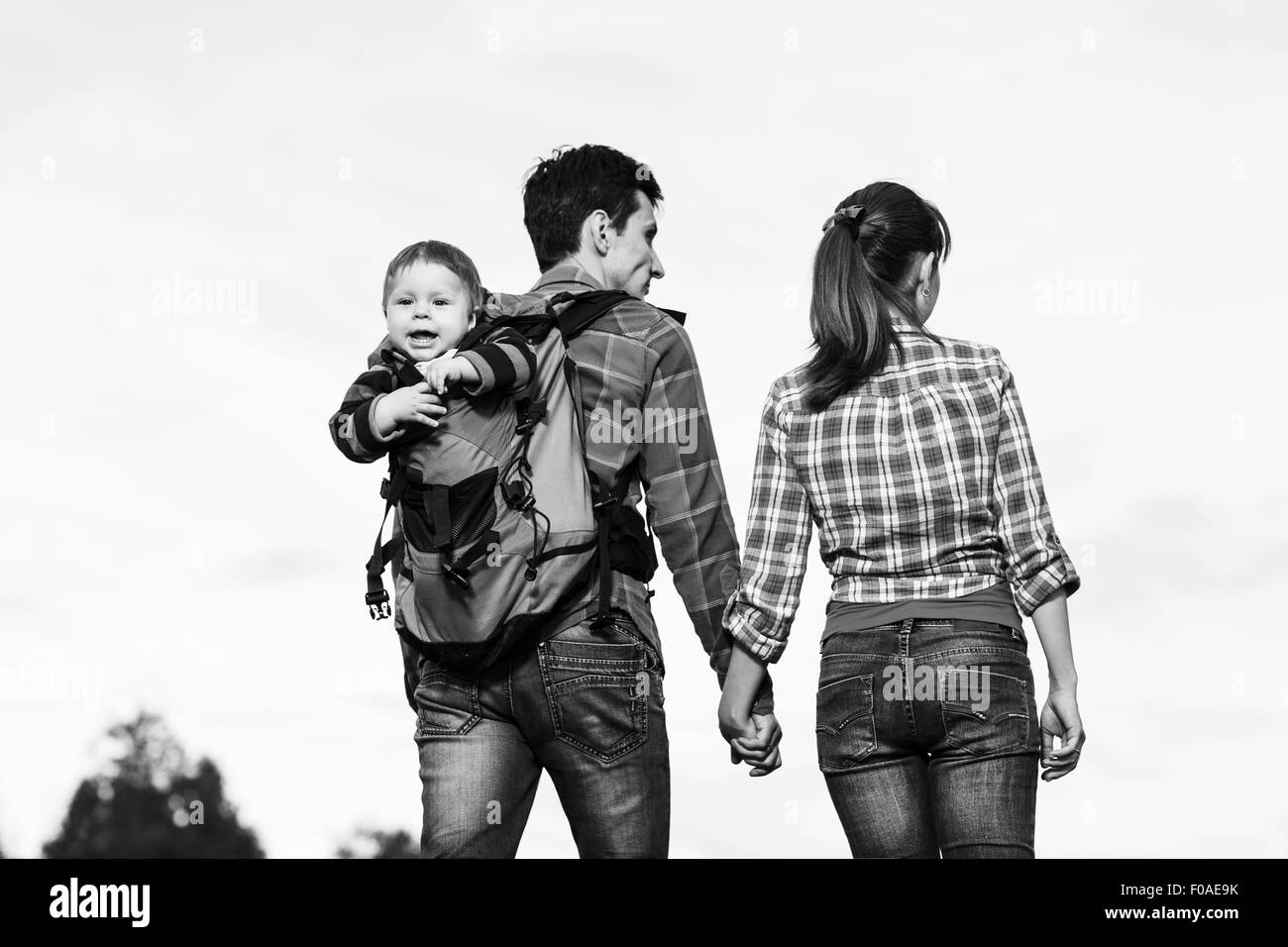 Baby boy in backpack Stock Photo - Alamy