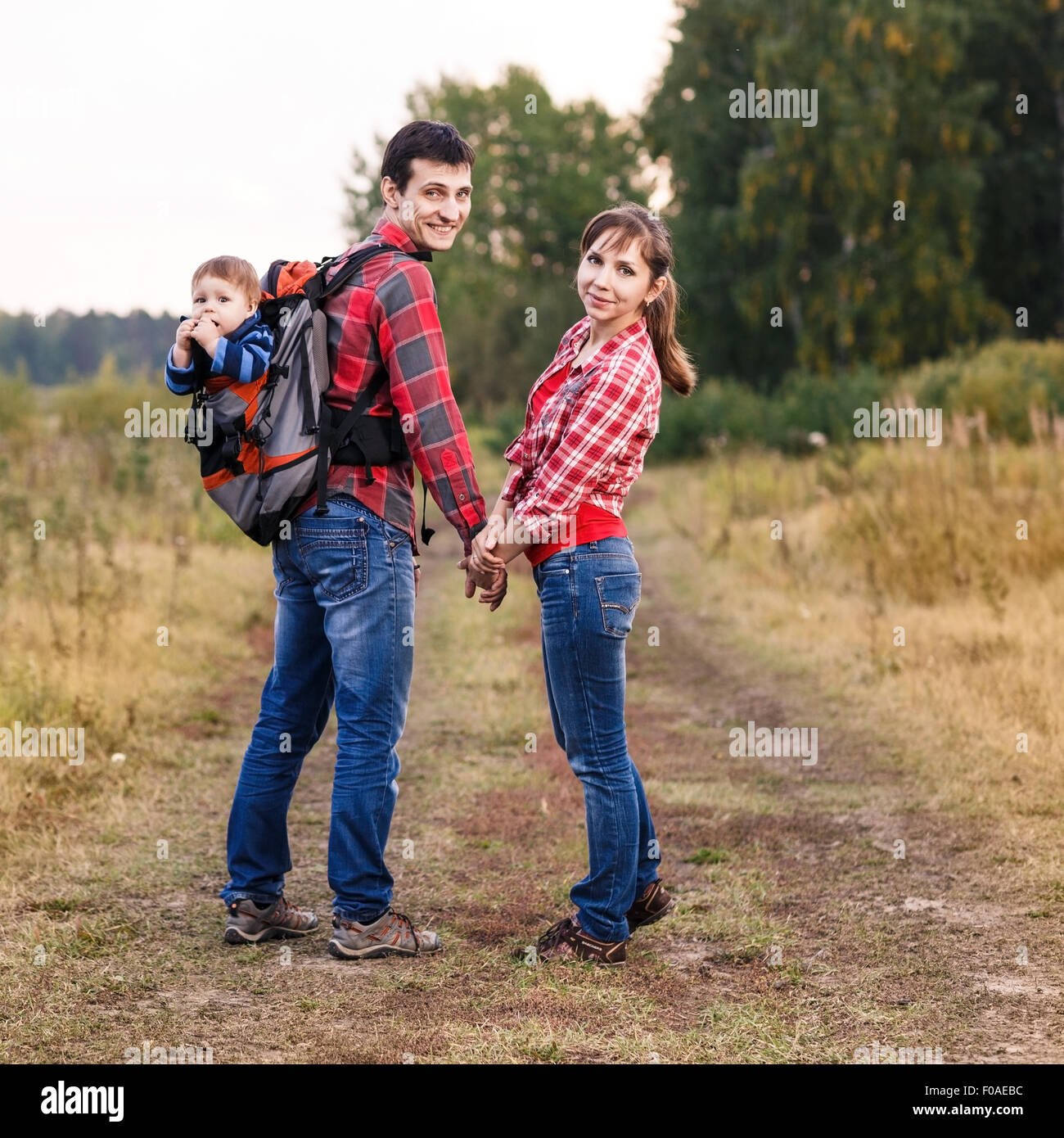 Baby boy in backpack Stock Photo - Alamy