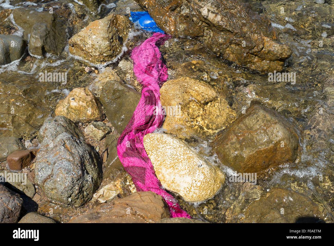 Clothes abandoned by Syrian refugees arriving by rubber boat on the ...
