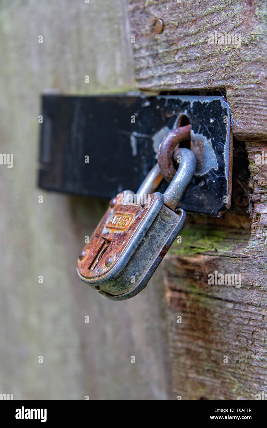 Padlock on a wooden door Stock Photo - Alamy