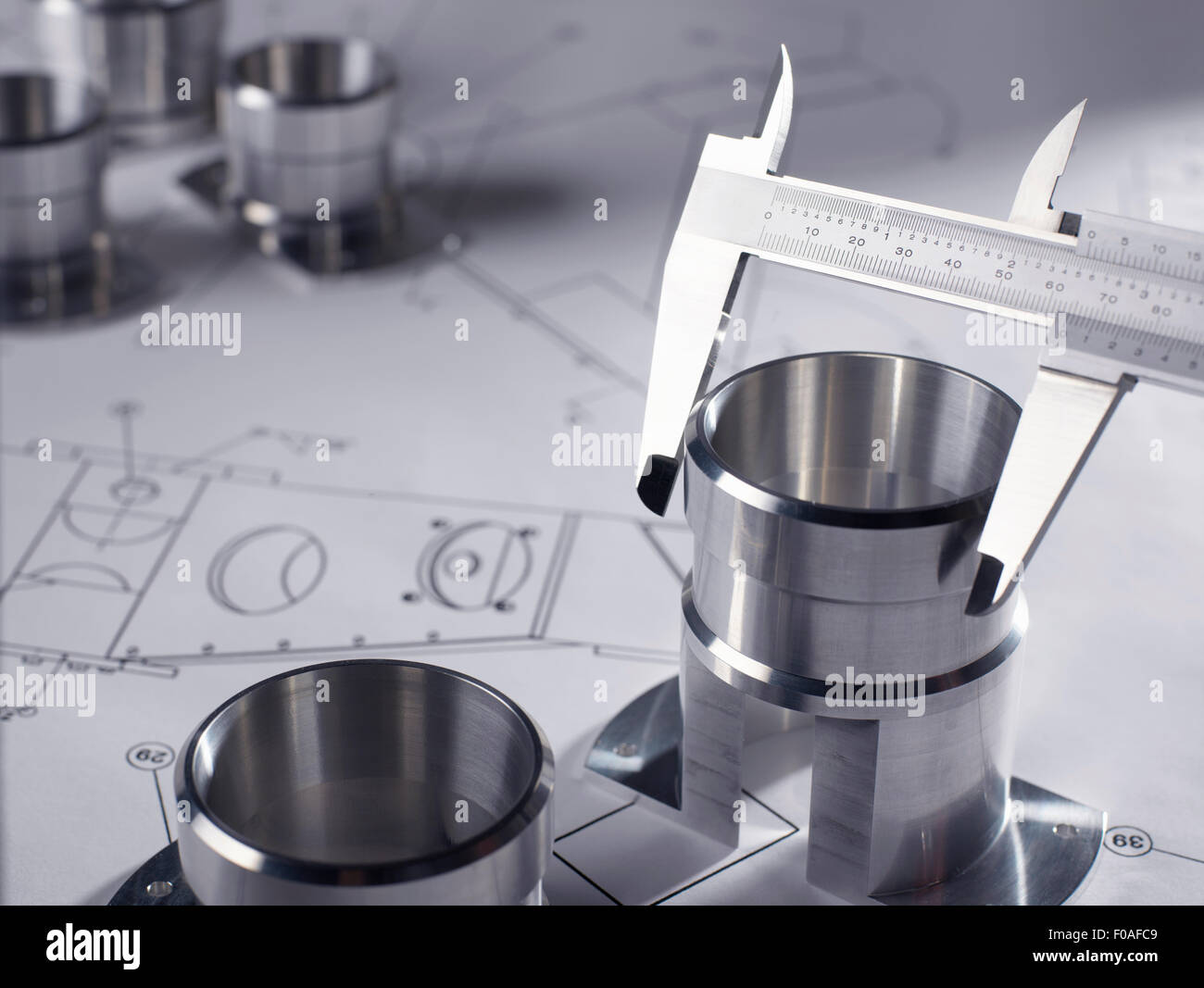 Dial calipers measuring a precision made component Stock Photo - Alamy