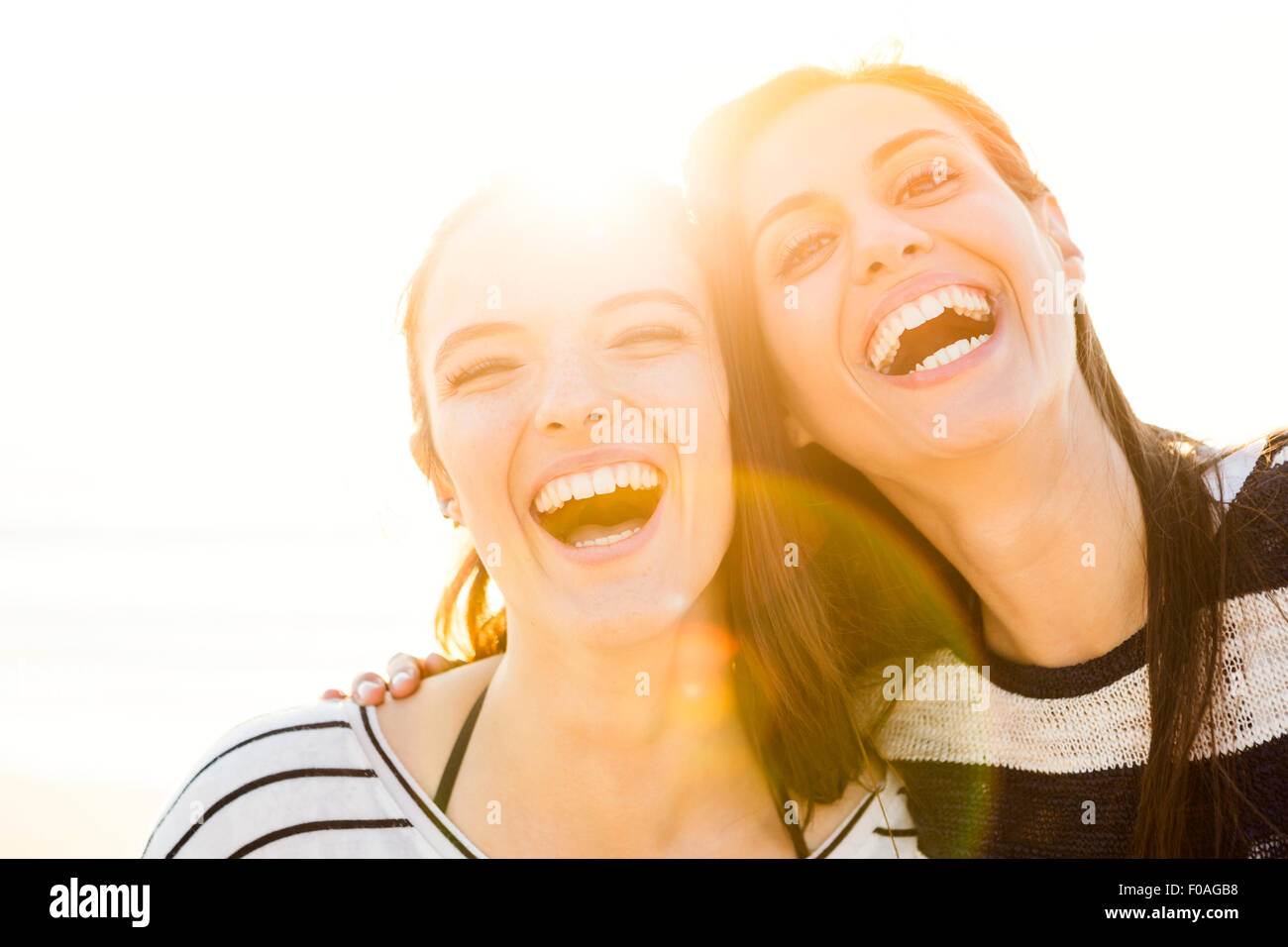 A portrait of best friends laughing Stock Photo - Alamy