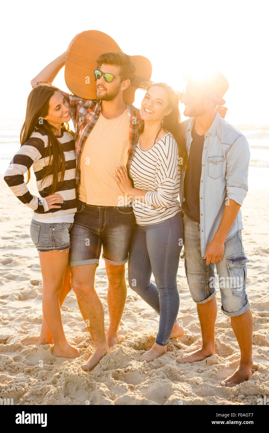 Friends at the beach having fun together Stock Photo - Alamy