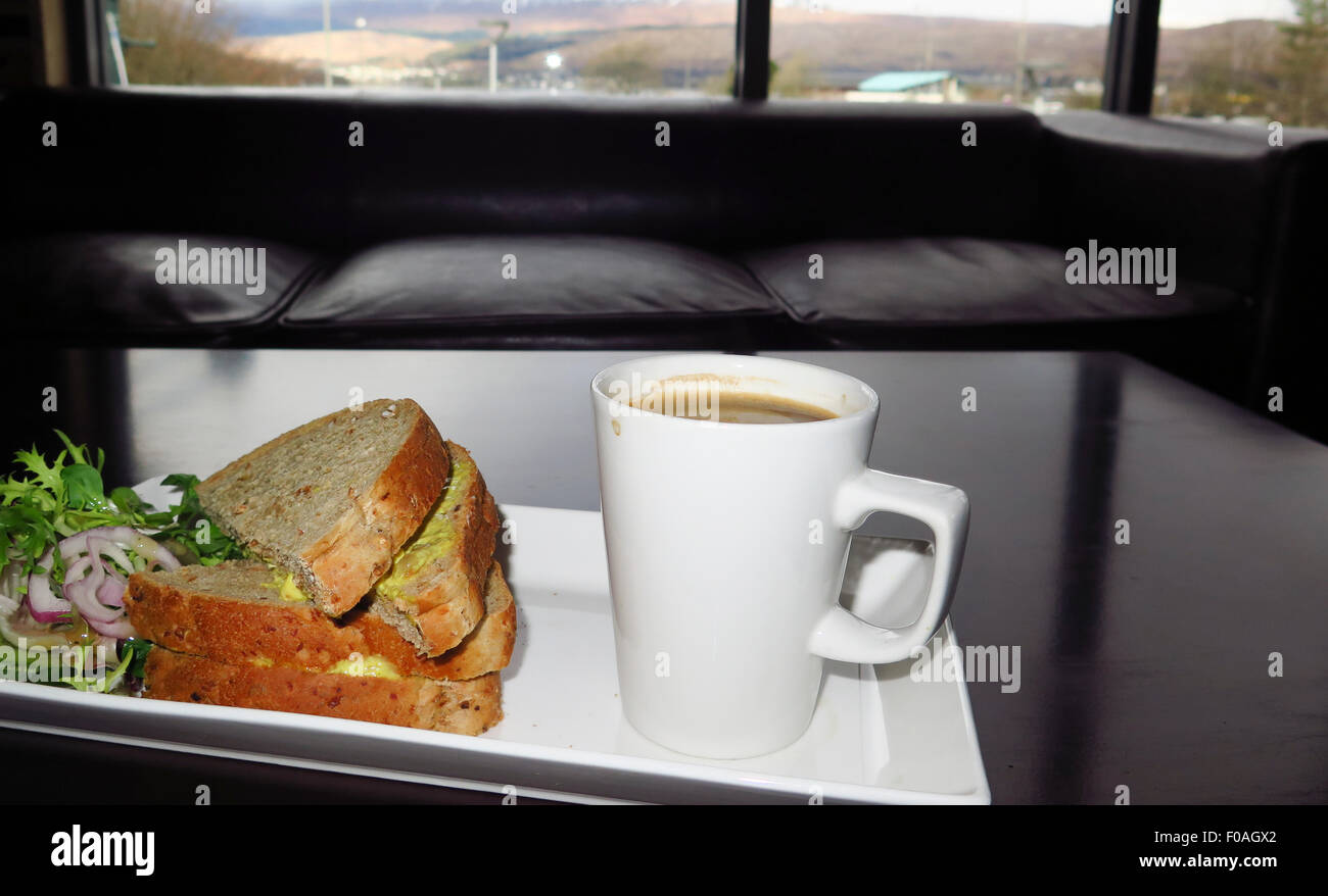 Coffee and sandwich on café table Stock Photo - Alamy