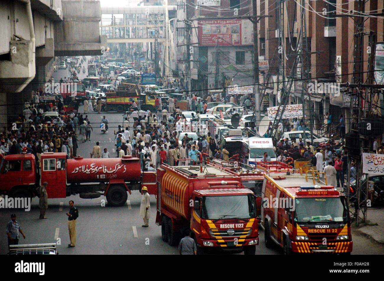 Lahore. 11th Aug, 2015. Fire brigades arrive at the fire site in ...