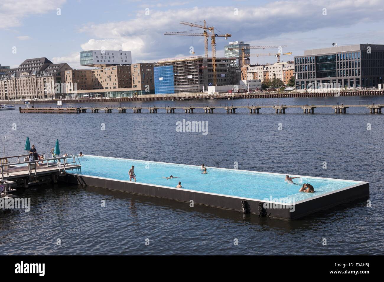 People enjoying at bathing ship pool on Spree river at Wrangelkiez ...