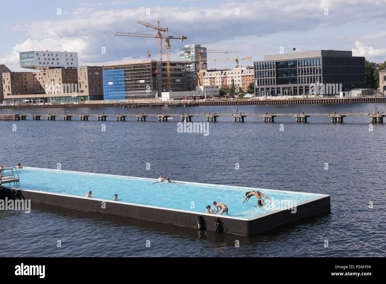 People enjoying at bathing ship pool on Spree river at Wrangelkiez ...
