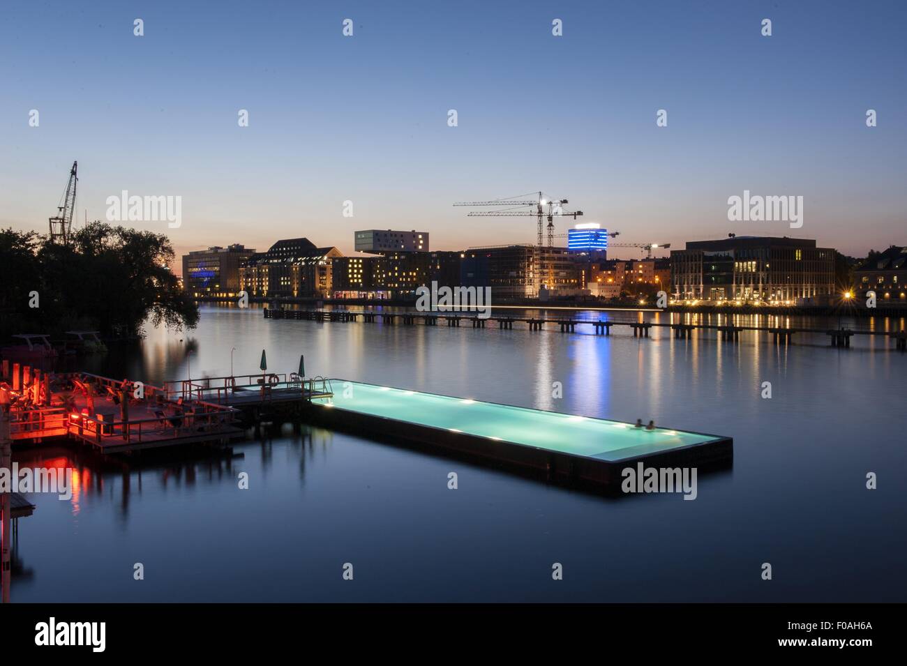 View of bathing ship pool on Spree river at dusk, Wrangelkiez, Berlin ...