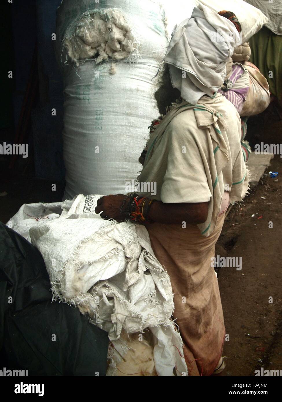 Indian waste cotton collector, Varanasi Stock Photo - Alamy