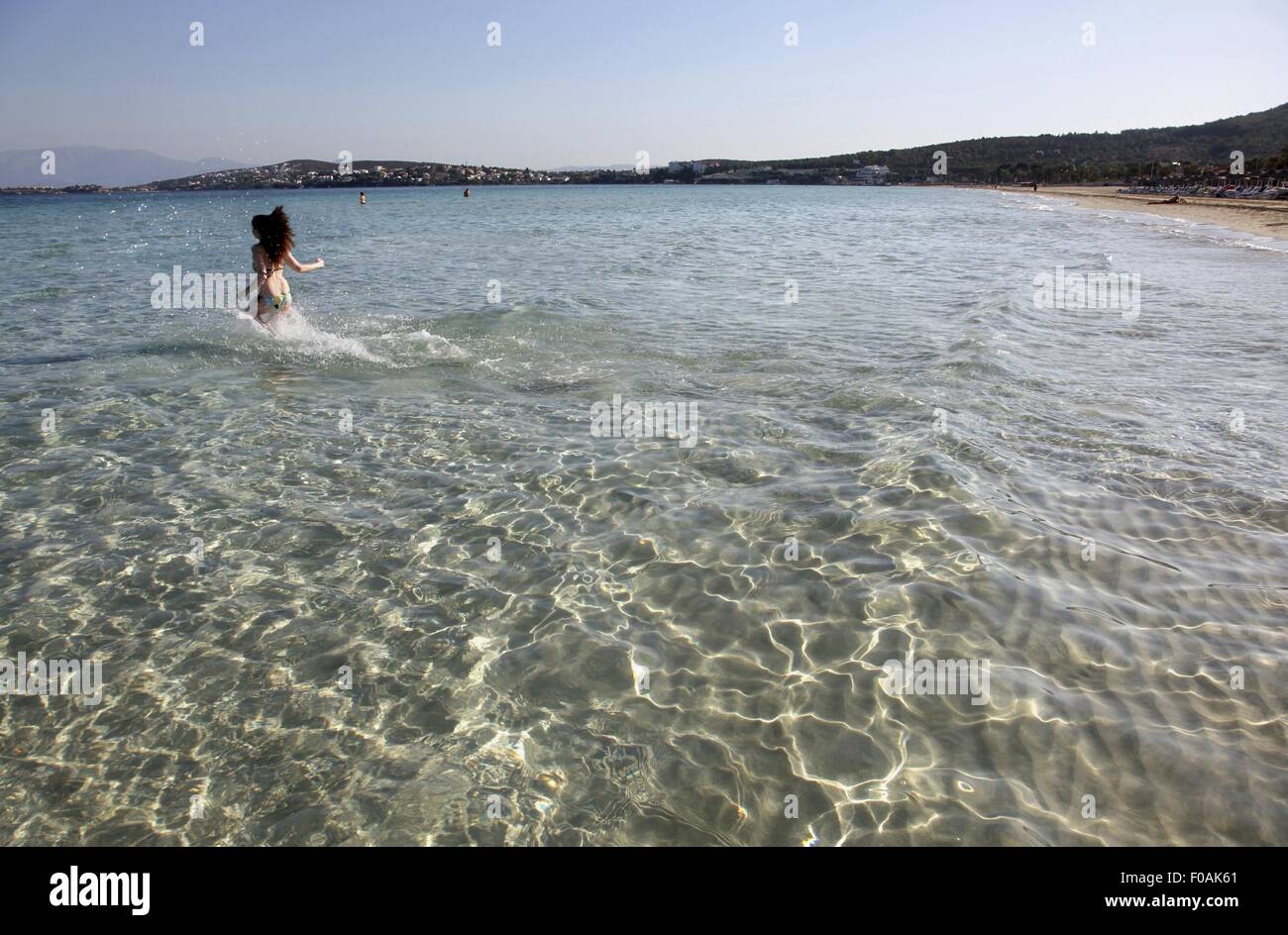 Man lying on Altinkum beach in Alacati, Cesme Peninsula, Turkey Stock ...
