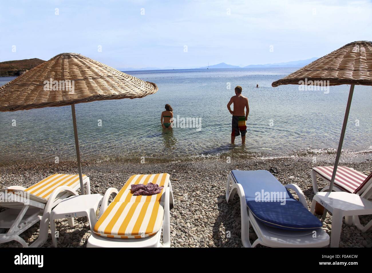 Tourists relaxing on beach of Kargi bay, Datca, Resadiye Peninsula ...