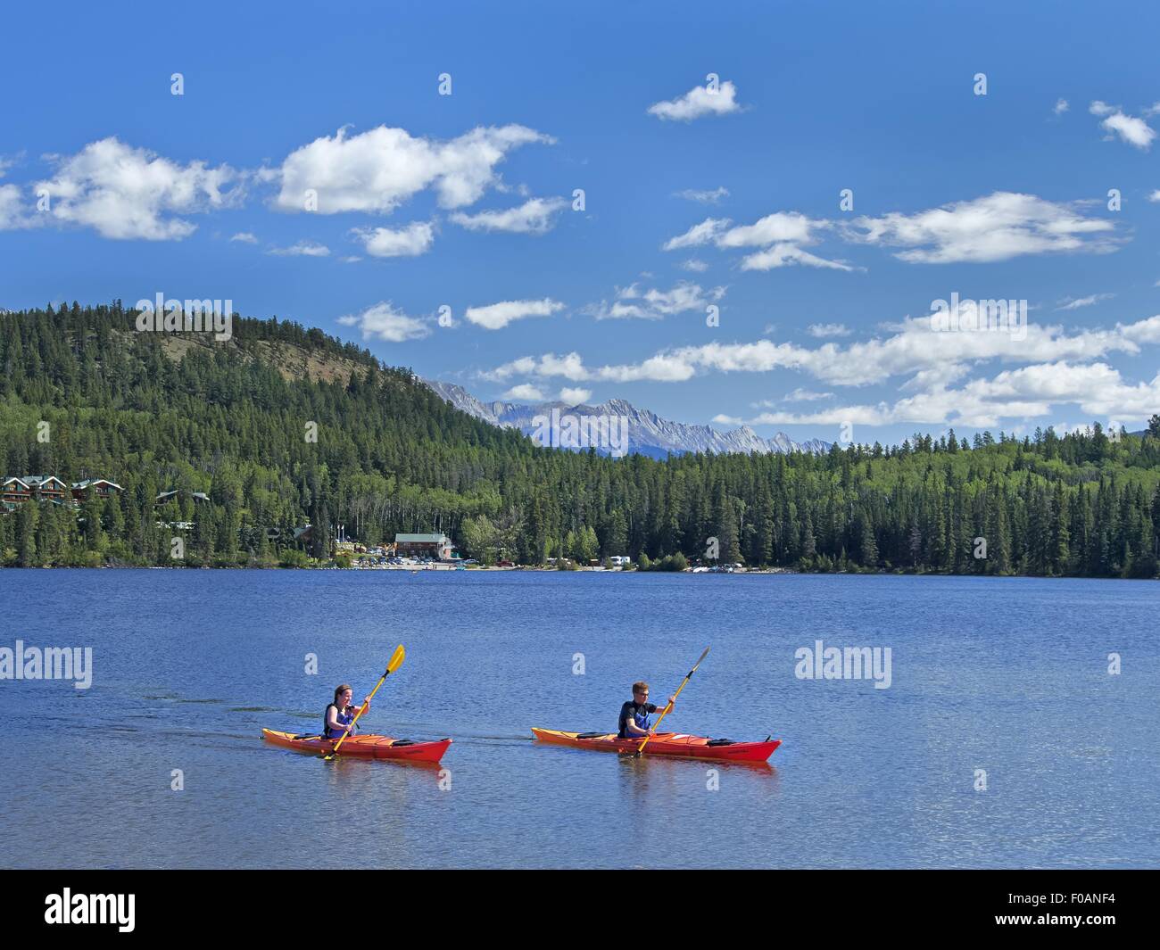 People in boats using kayaking at Pyramid Lake, Jasper National Park ...