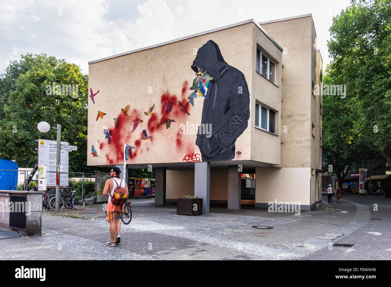 Berlin Kreuzberg Street Art Mural Hooded Man And Colorful Birds By Berlin Kreuzberg Street Art Mural Hooded Man And Colorful Birds By