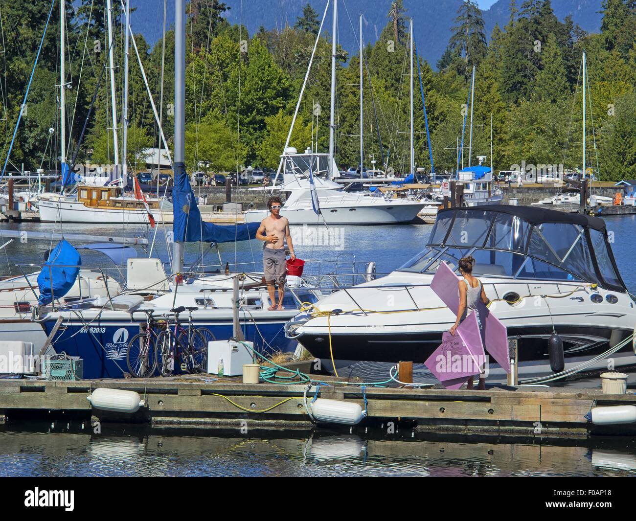 People at harbor of Bayshore West Marina in Vancouver, British Columbia ...