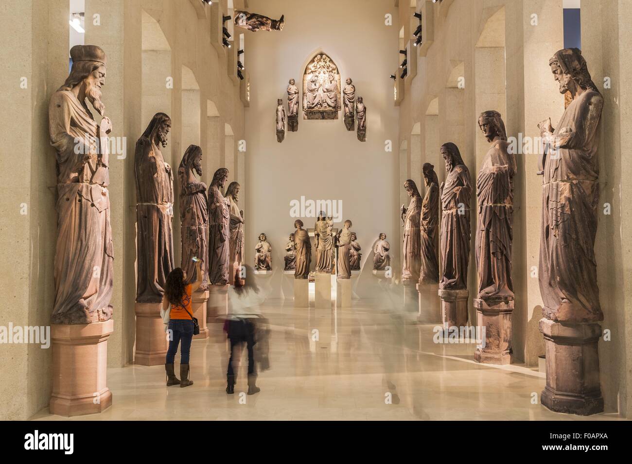 Children looking at sculptures of prophets in Munster at sculpture hall ...