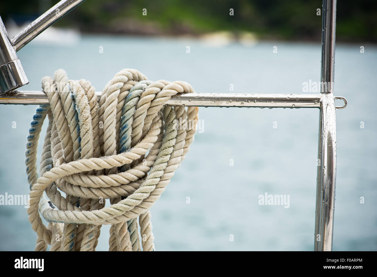 A mooring rope with a knotted end tied around a lifeline Stock Photo ...