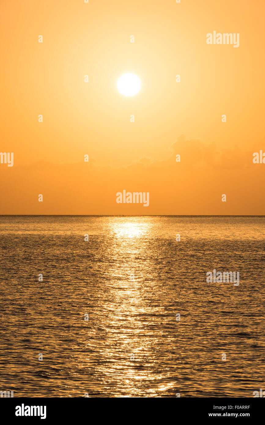 Beautiful tropical sunset ocean background. Vertical shot Stock Photo ...