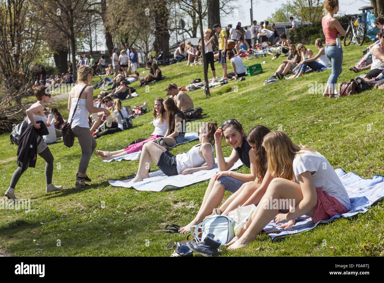 People sunbathing in Dreisamstadion at Freiburg, Germany Stock Photo ...